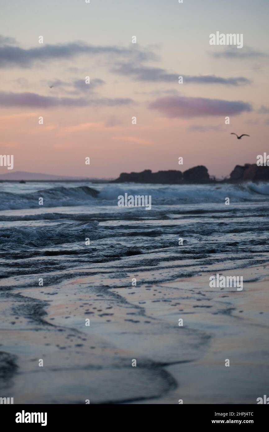 Vertical shot snowy beach waves hi-res stock photography and images - Alamy