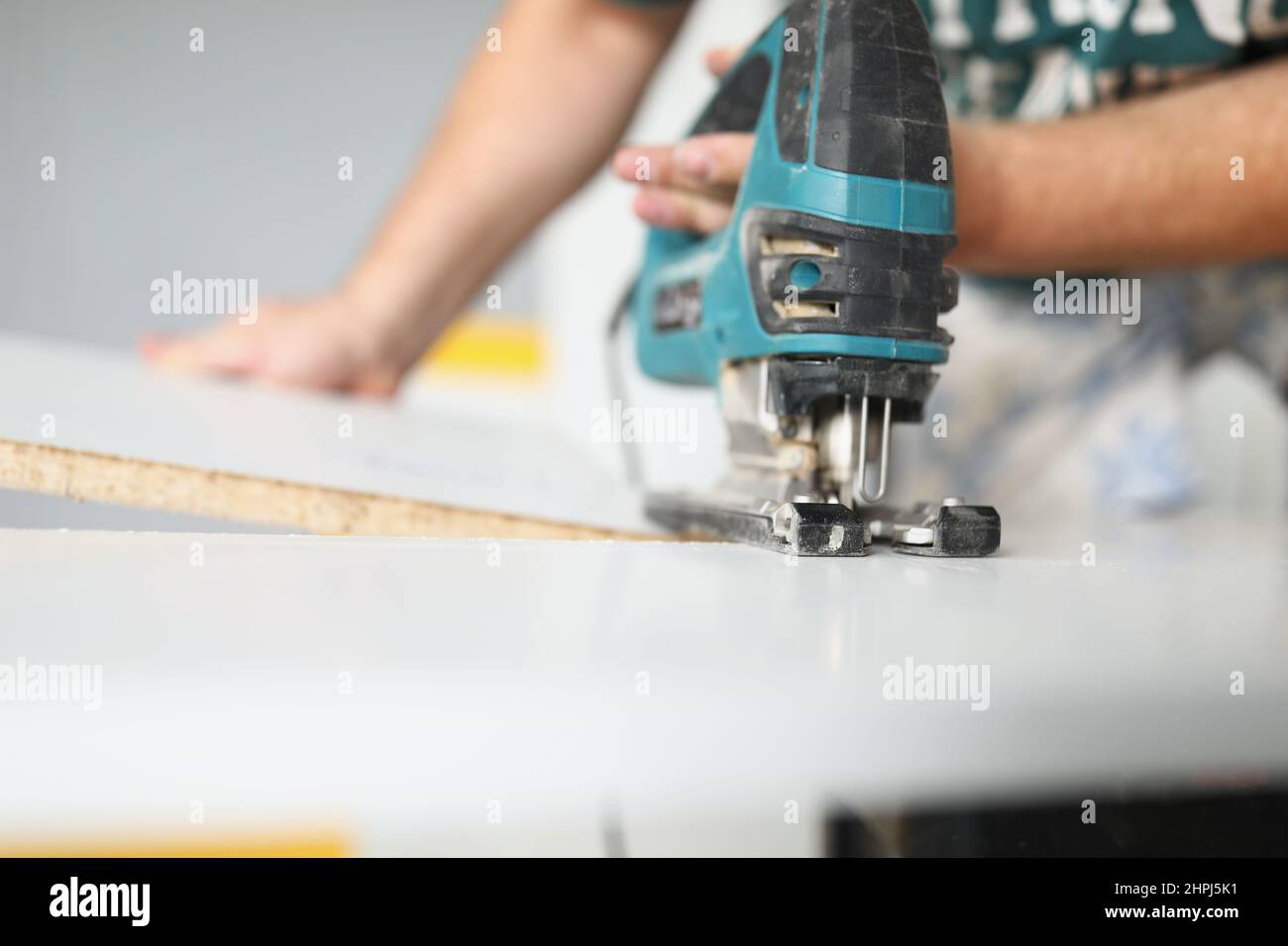 Man using tool for work Stock Photo - Alamy