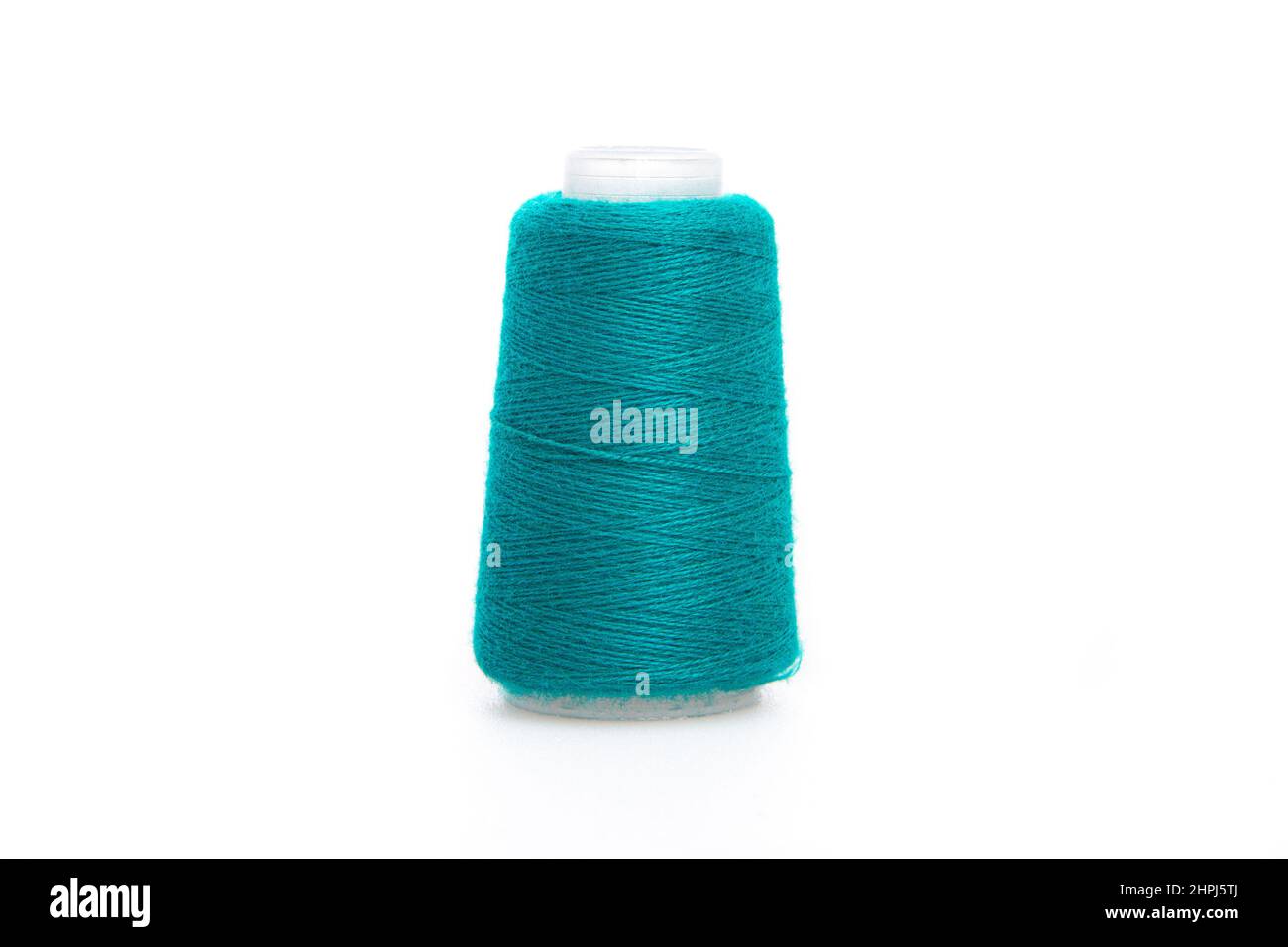 Green spool of thread isolated on white background. Skein of woolen ...