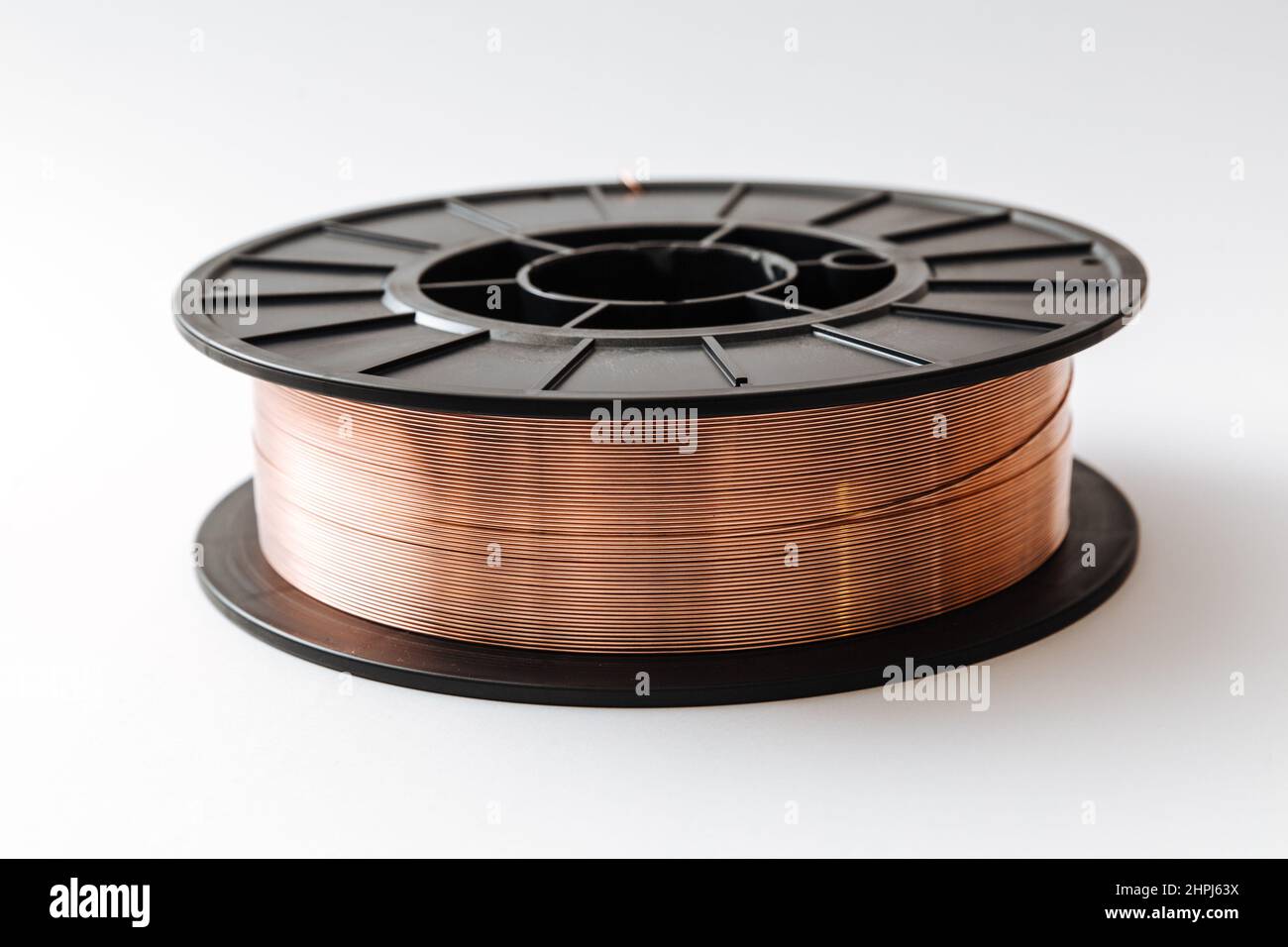Welding wire spool on a white background Stock Photo - Alamy