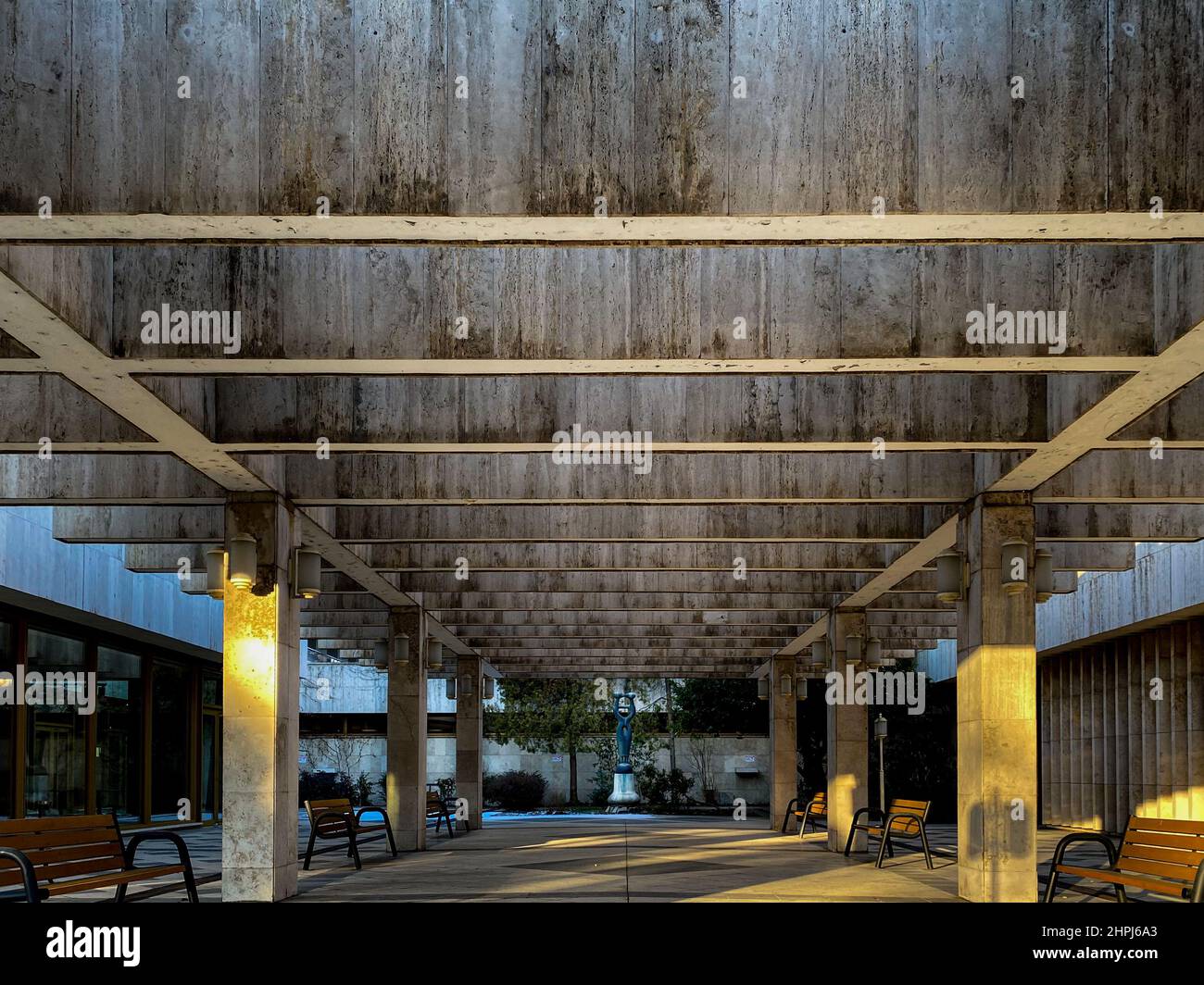 Roof with concrete structures on thick columns with statue on the ...