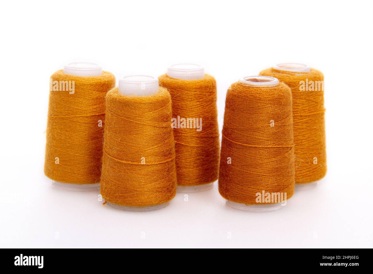 Orange spool of thread isolated on white background. Skein of woolen ...