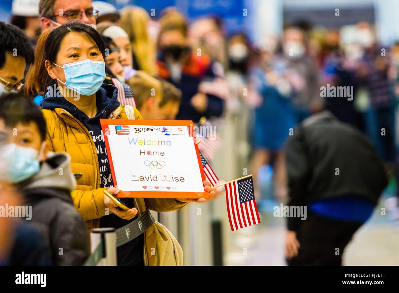 Reno, United States. 21st Feb, 2022. A woman holds a sign welcoming ...