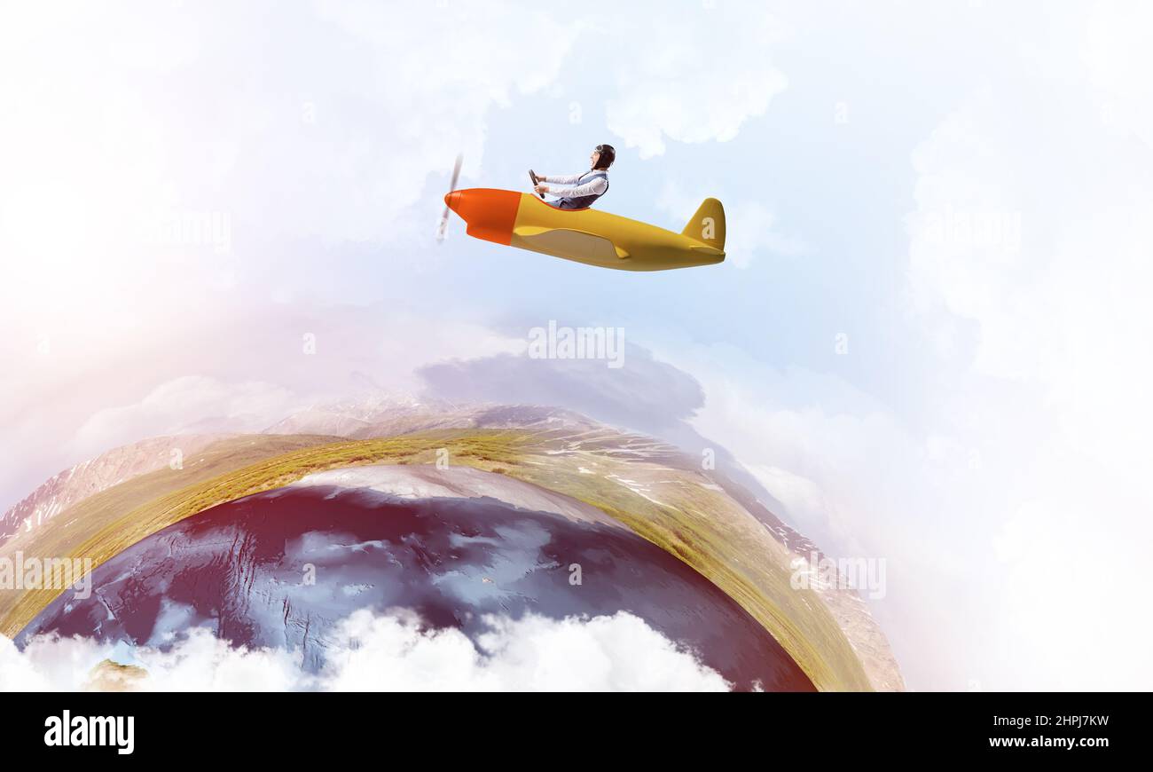 Happy pilot driving small propeller plane Stock Photo - Alamy