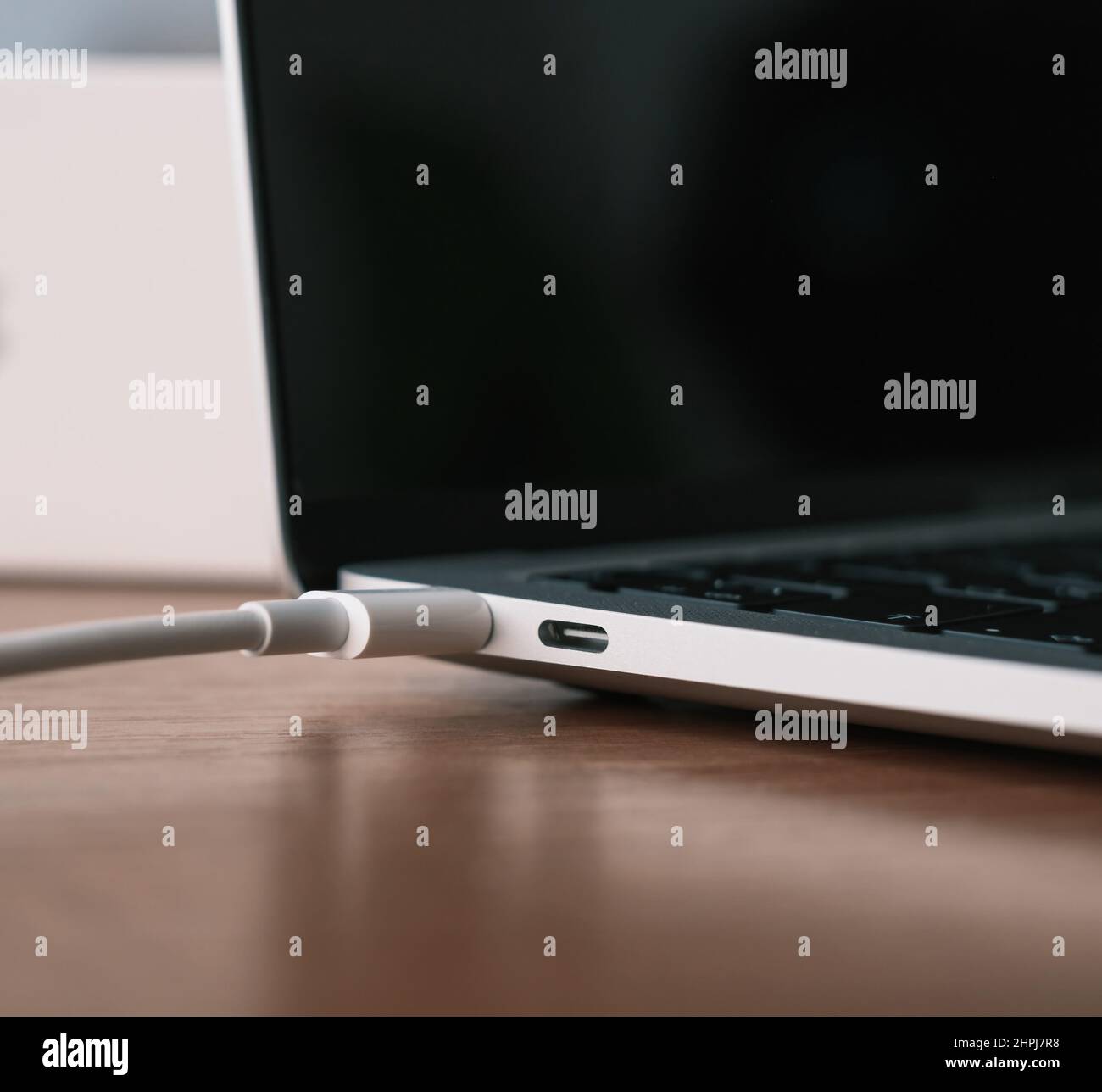 Close-up of a laptop charging through a type C usb port Stock Photo - Alamy