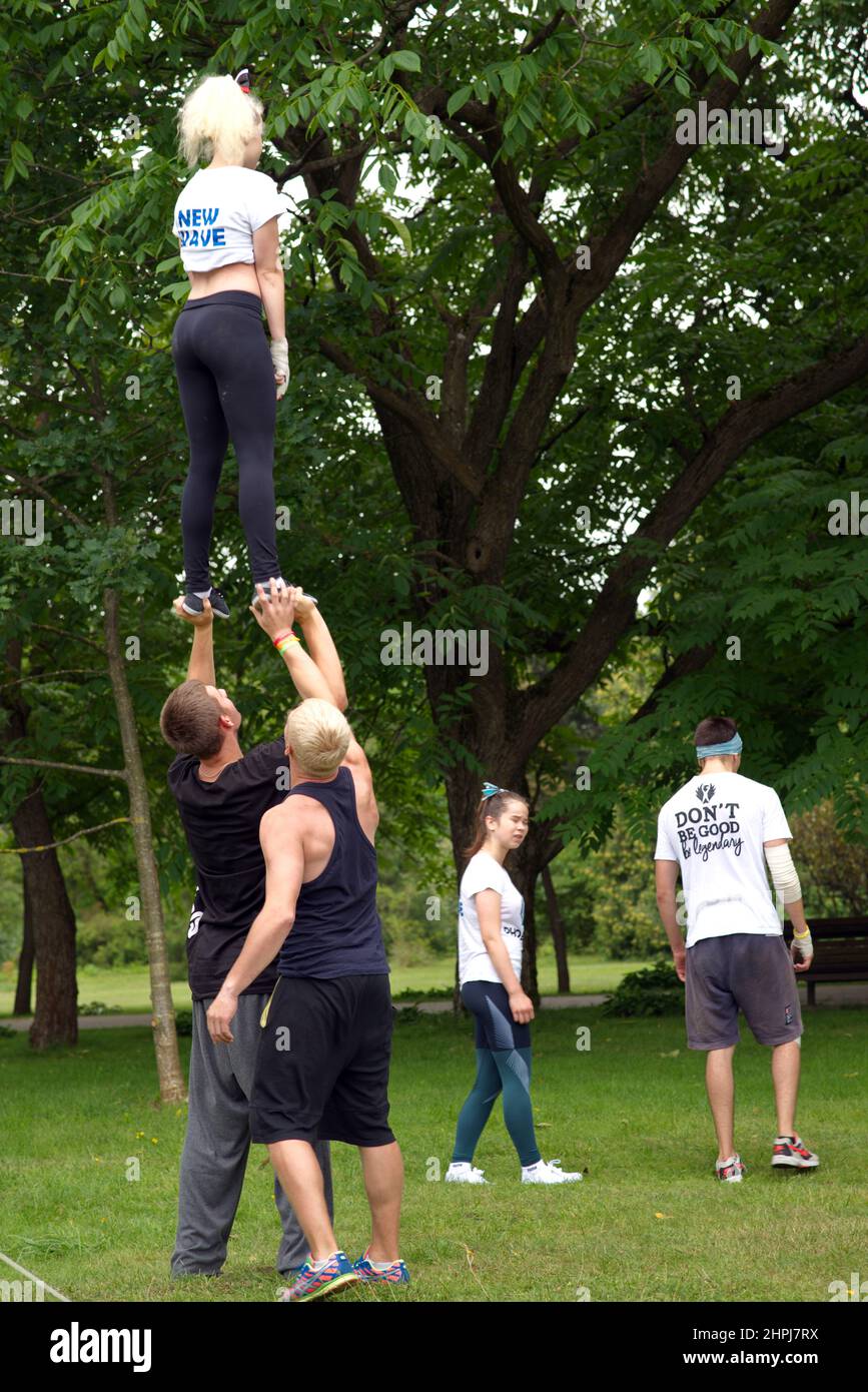 Group of excited young cheerleaders cheering on field Stock Photo - Alamy