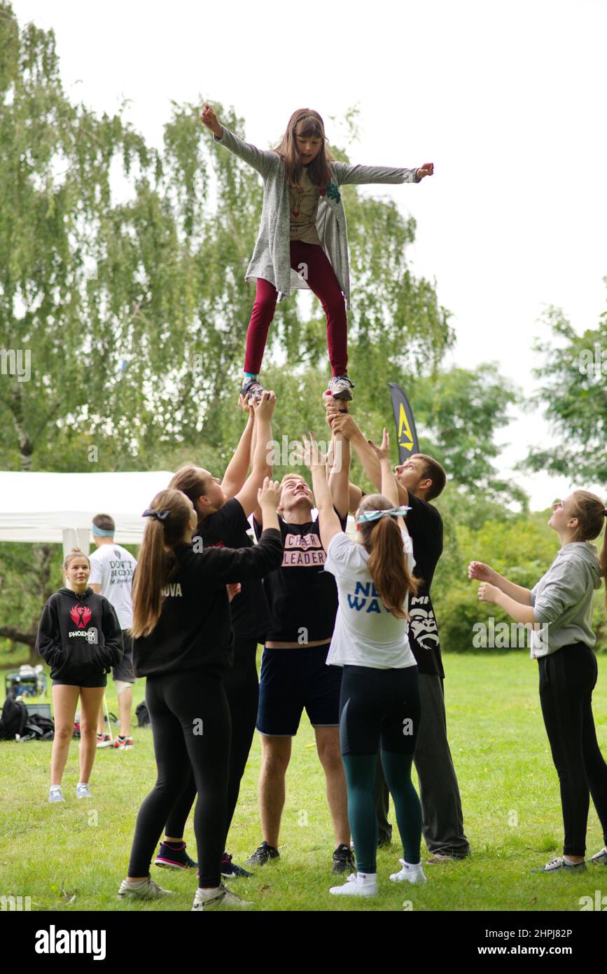 Group of excited young cheerleaders cheering on field Stock Photo - Alamy