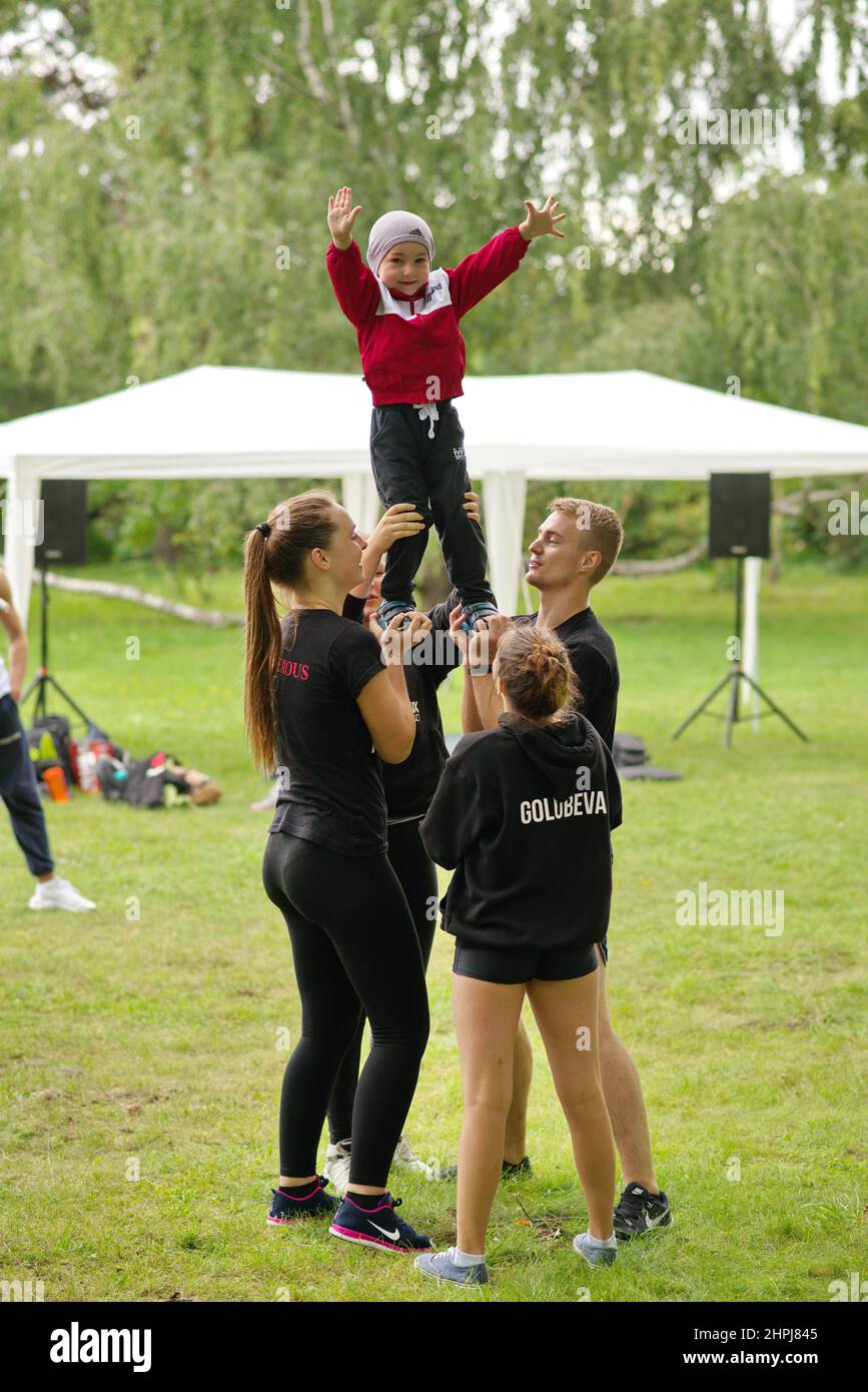 Group of excited young cheerleaders cheering on field Stock Photo - Alamy