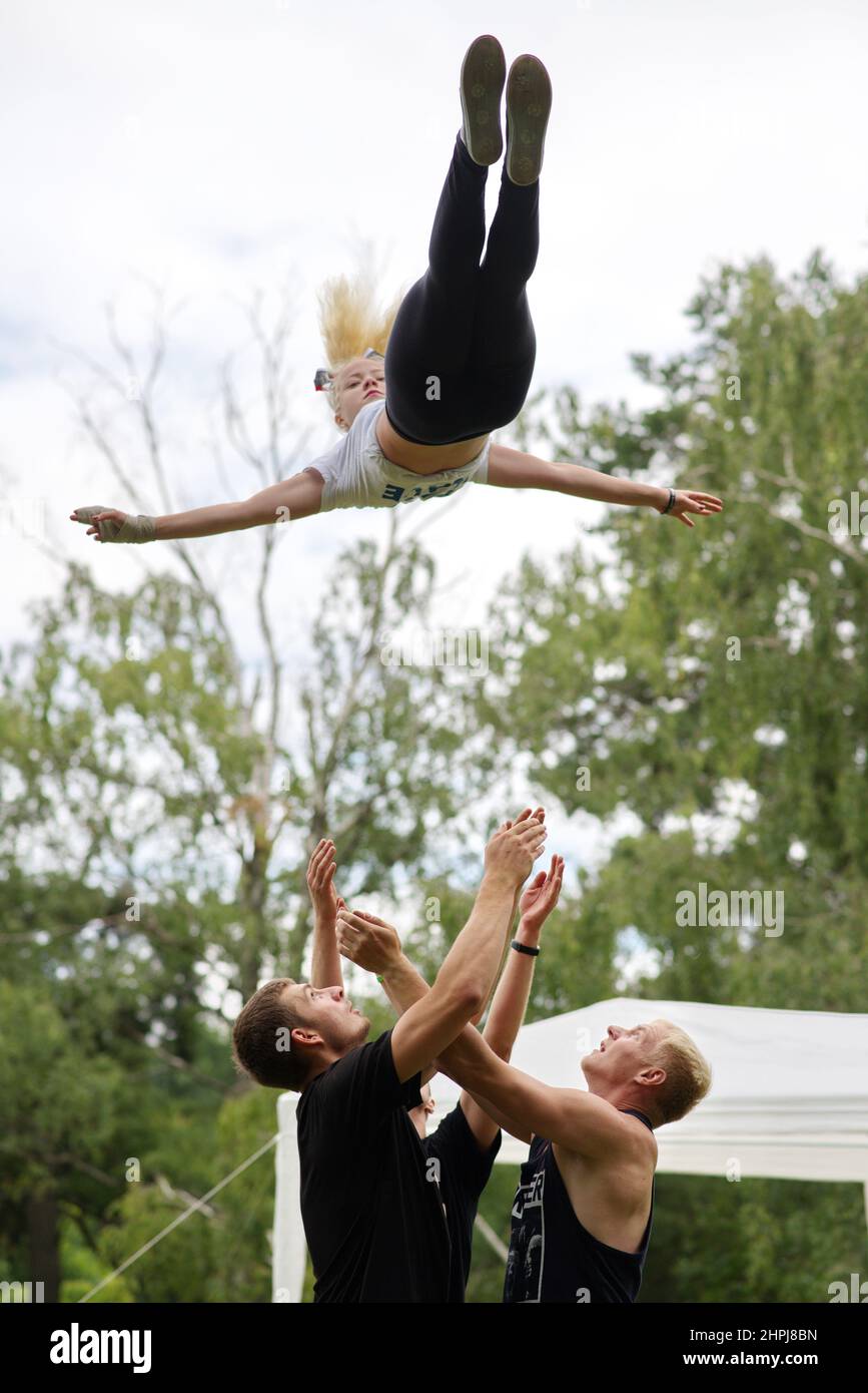 Group of excited young cheerleaders cheering on field Stock Photo - Alamy