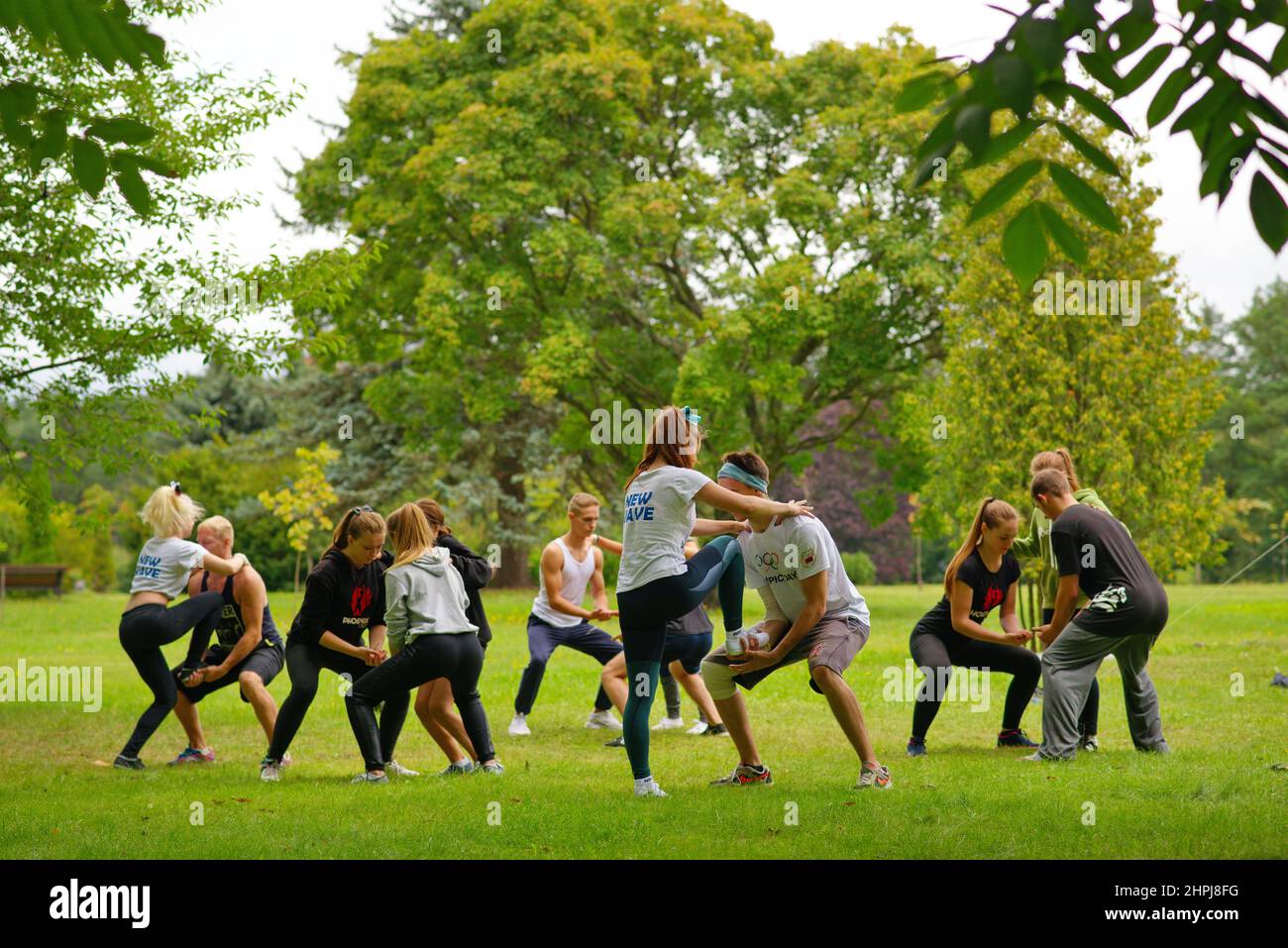 Group of excited young cheerleaders cheering on field Stock Photo - Alamy