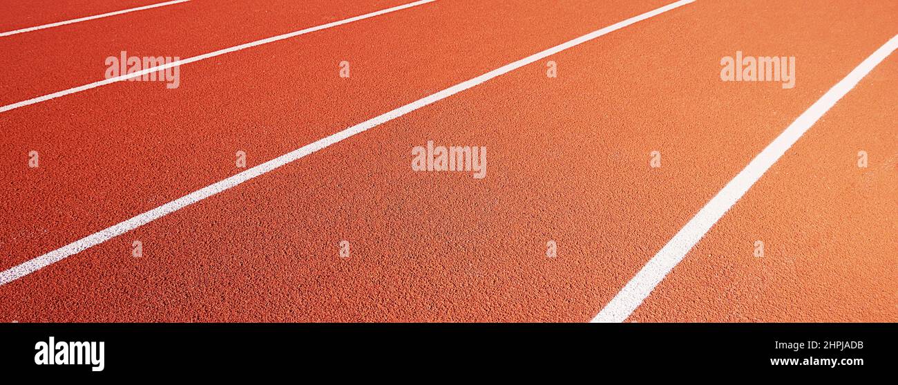 Red runninng race track with border lanes closeup, Treadmill at stadium ...