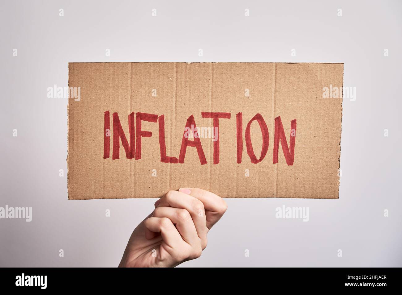 World economic crisis and inflation concept, Woman hold paper sheet ...