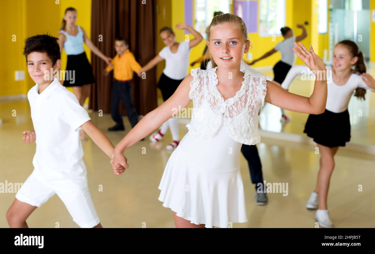 Boys and girls enjoying active dance Stock Photo - Alamy