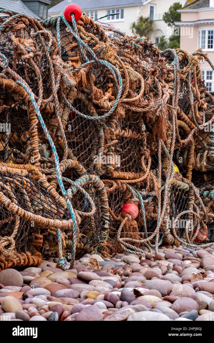 Ropes and lobster pots pilled high on a pebble beach Stock Photo - Alamy