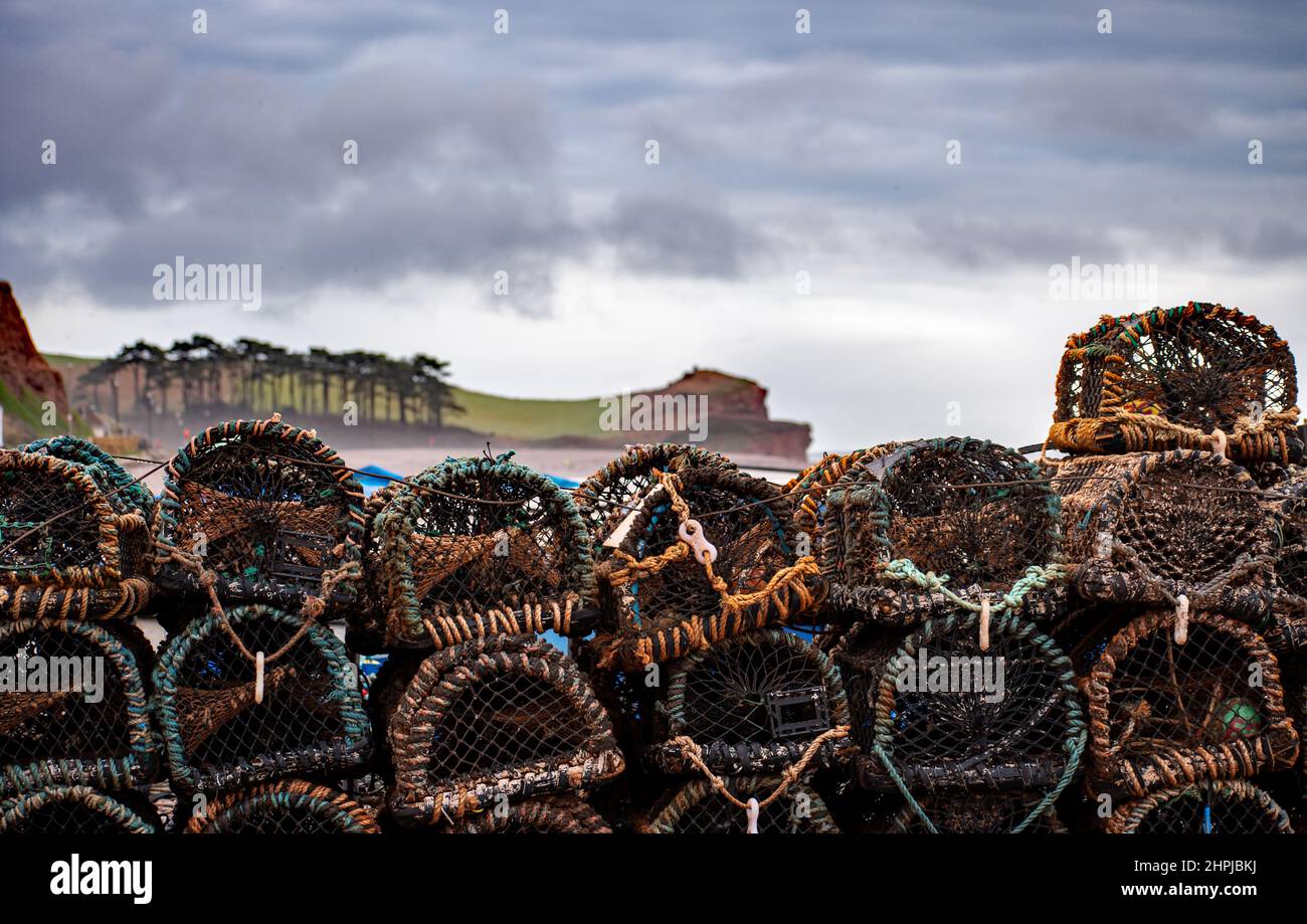 Ropes and lobster pots pilled high on a pebble beach Stock Photo - Alamy
