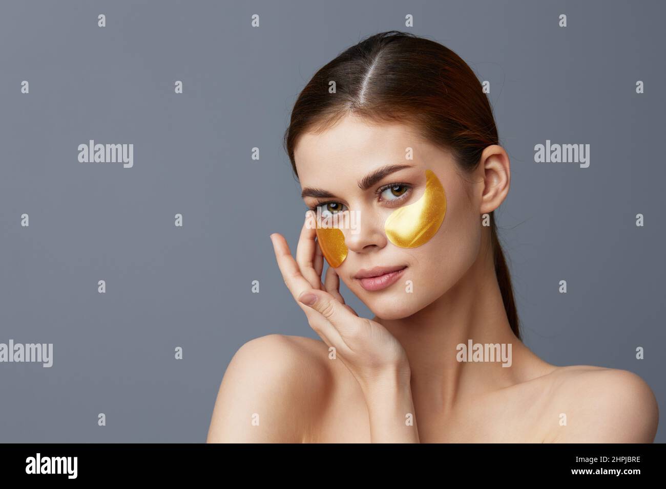 woman golden patches on the face isolated background Stock Photo - Alamy