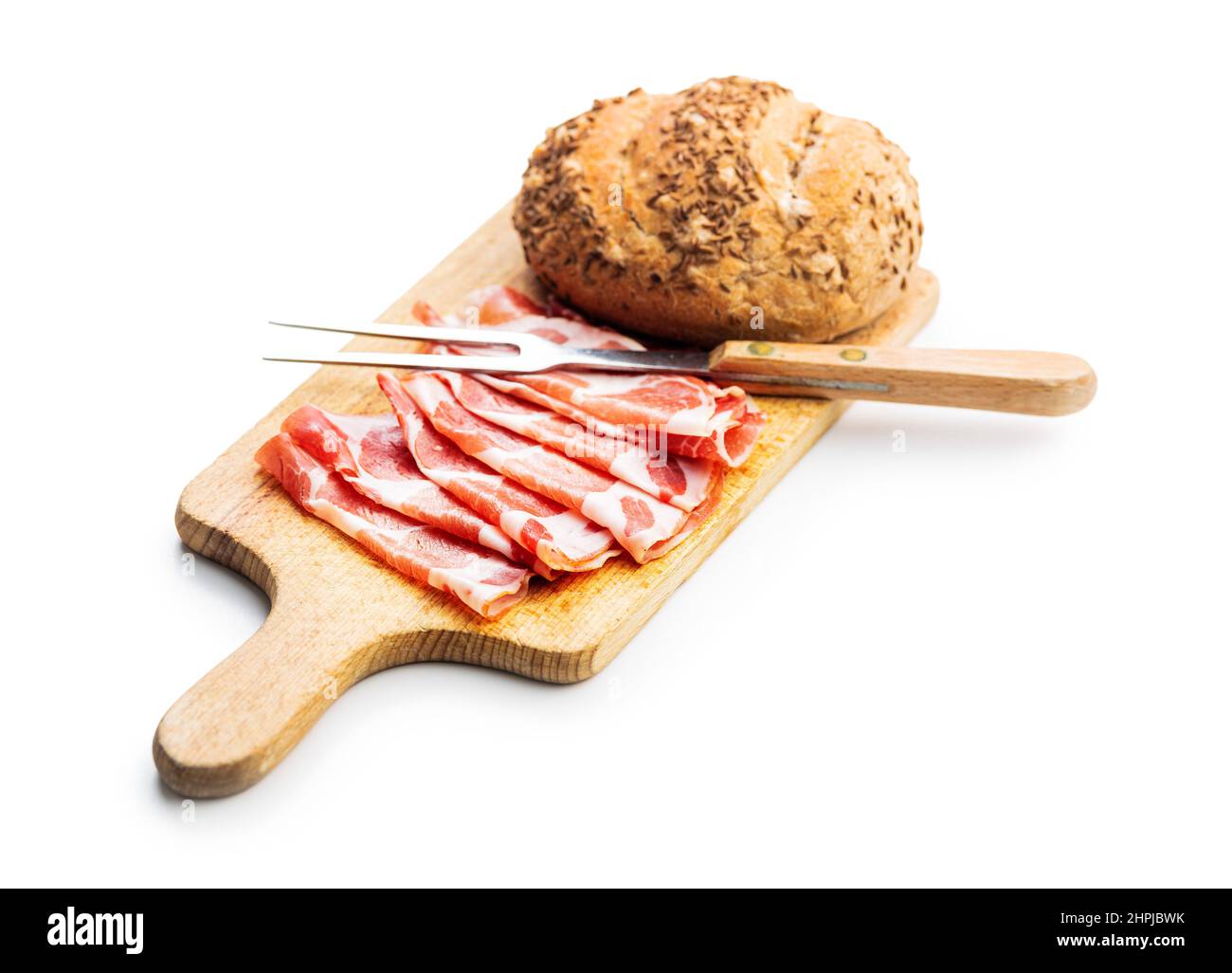 Italian dried ham. Coppa Stagionata on cutting board isolated on a ...