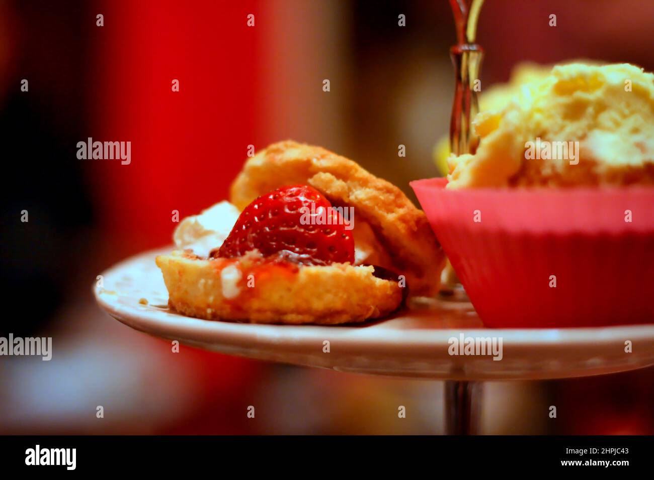 an eye-level view of a dessert platter carrying a pastry with a glazed ...