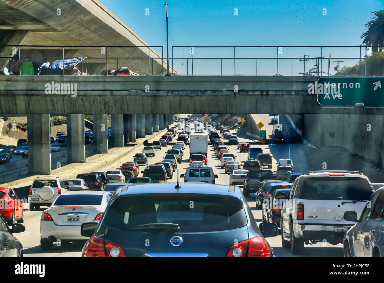 a close up shot of an extremely busy two-lane highway on a clear sunny ...