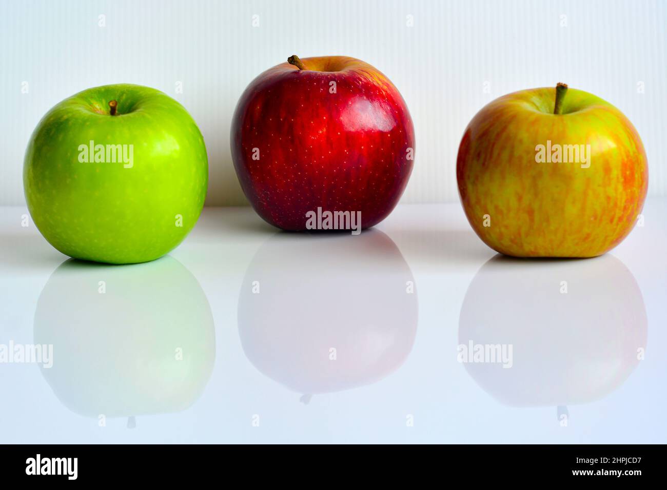 Colorful apples, red green and yellow fruit, isolated on white background. Health concept Stock ...