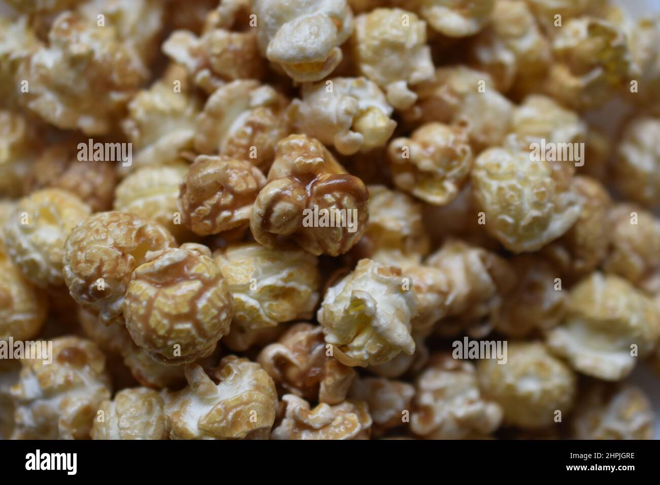 Popcorn covered with icing and caramel with sugar Stock Photo - Alamy