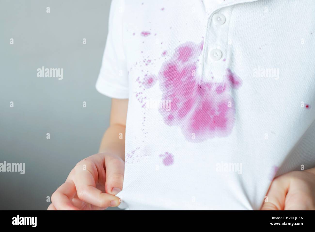 Dirty stain of spilling juice on children's clothes. High quality photo ...