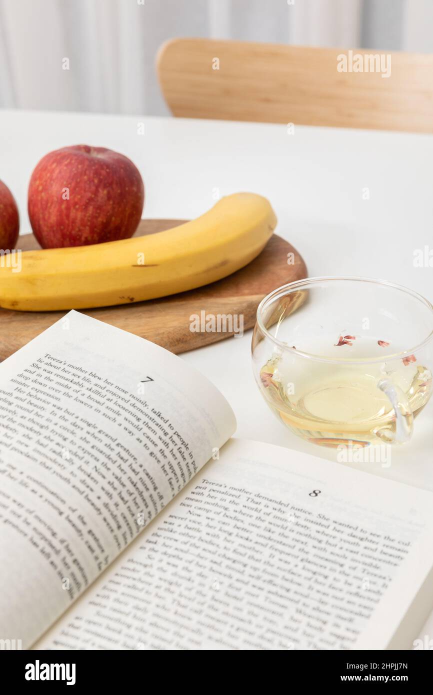 relax cozy objects and background with a book, tea, fruits Stock Photo ...