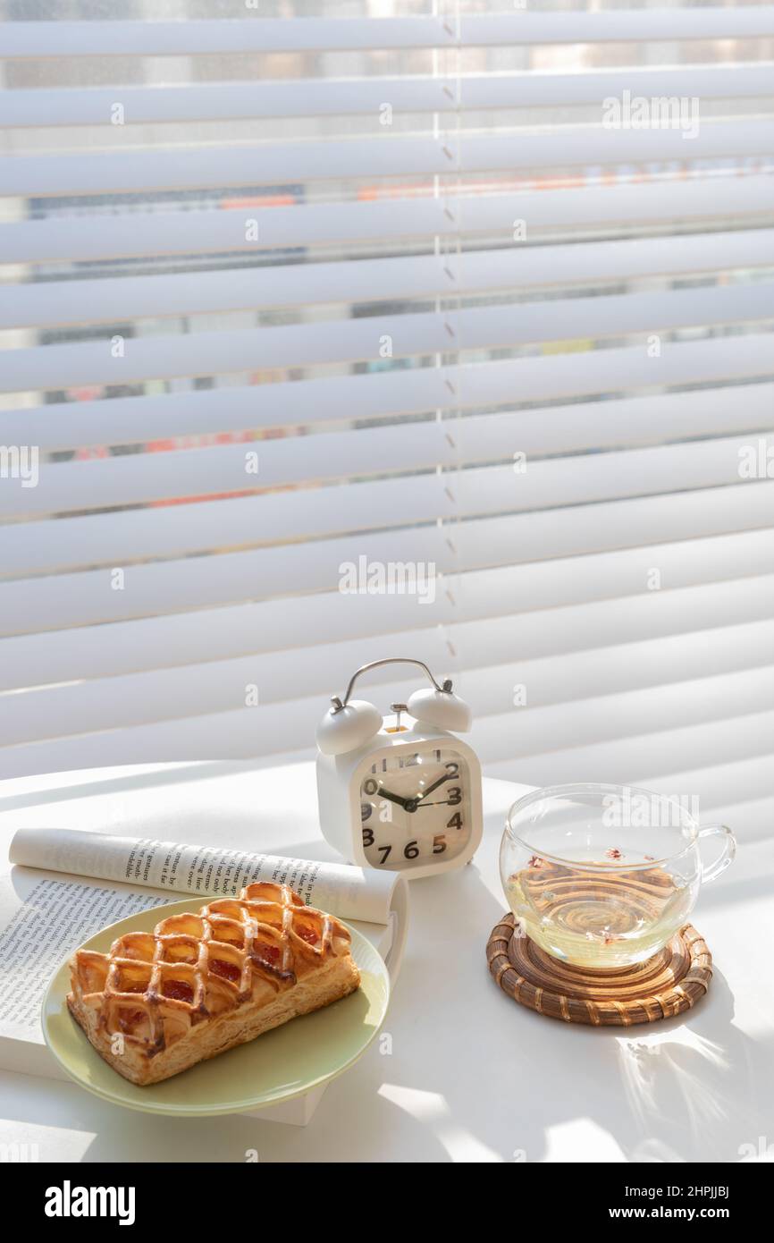 relax cozy objects and background with tea, pie, a book, clock Stock ...
