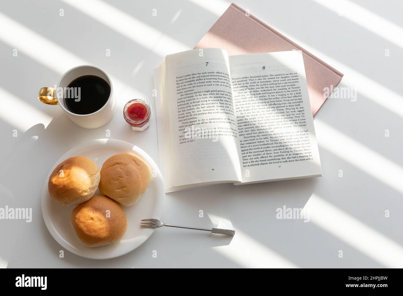 relax cozy objects and background with bread, coffee, candle, a book ...