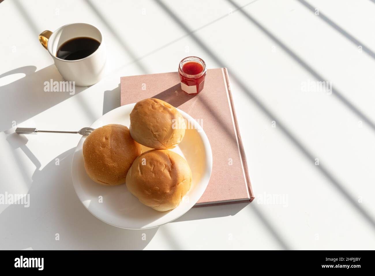 relax cozy objects and background with bread, coffee, candle, a book ...