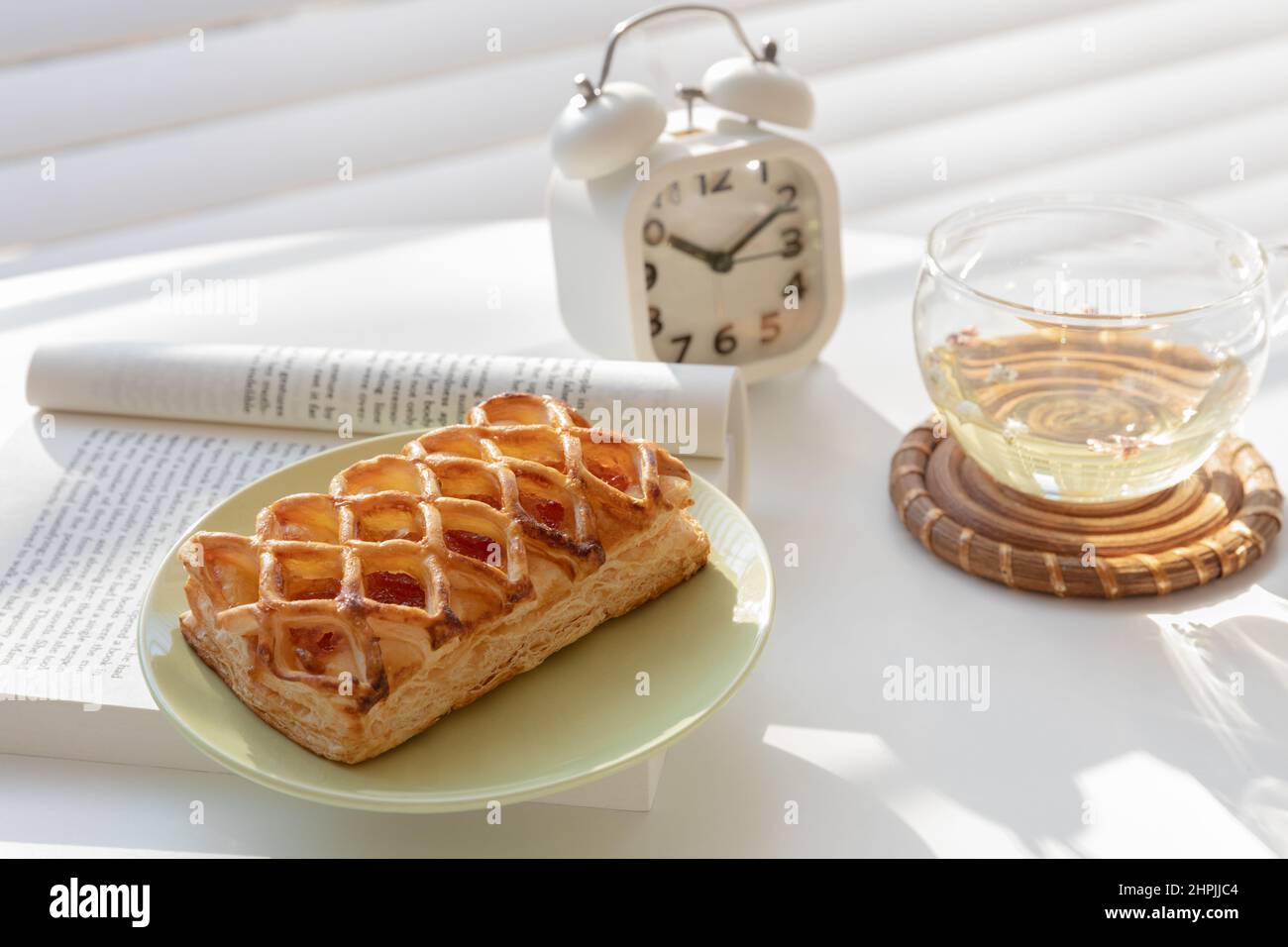 relax cozy objects and background with tea, pie, a book, clock Stock ...
