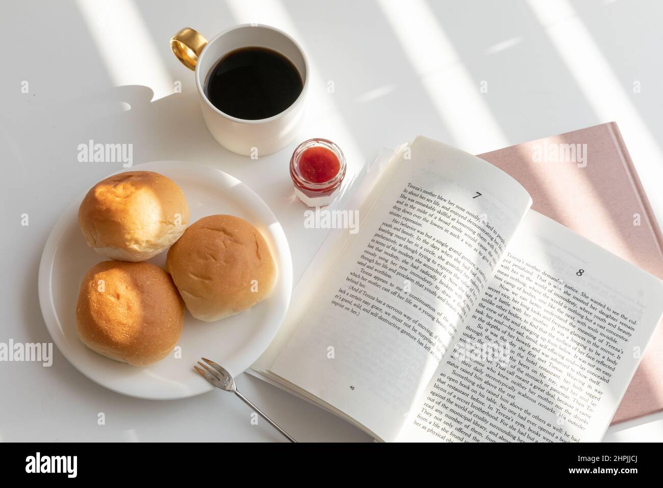 relax cozy objects and background with bread, coffee, candle, a book ...