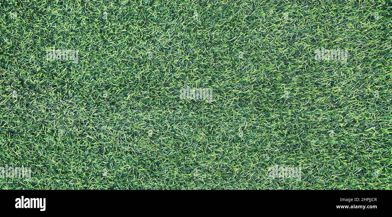Panorama of New Green Artificial Turf Flooring texture and background ...