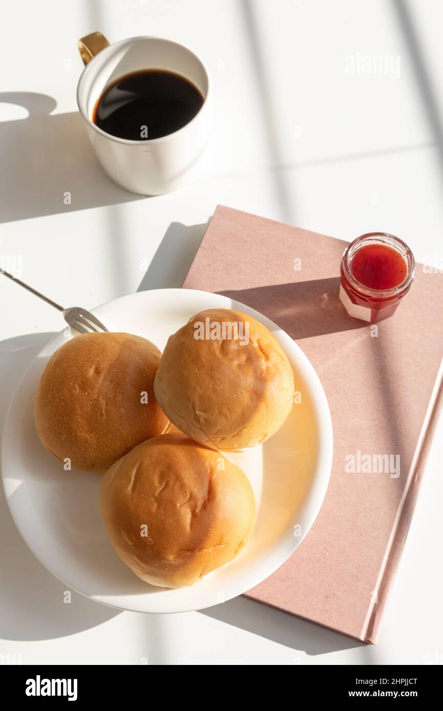 relax cozy objects and background with bread, coffee, candle, a book ...