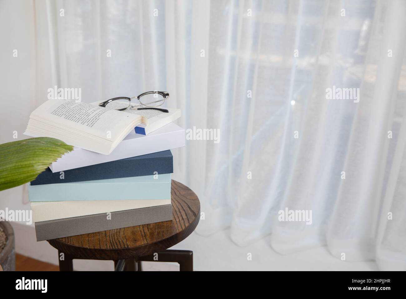 relax cozy objects and background with glasses, a book Stock Photo - Alamy