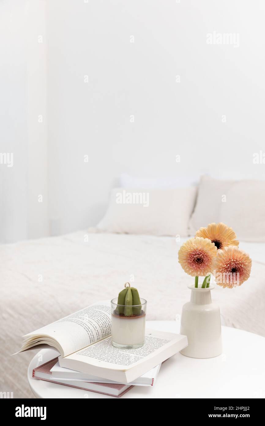 relax cozy objects and background with flowers, flower pot, candle, a ...