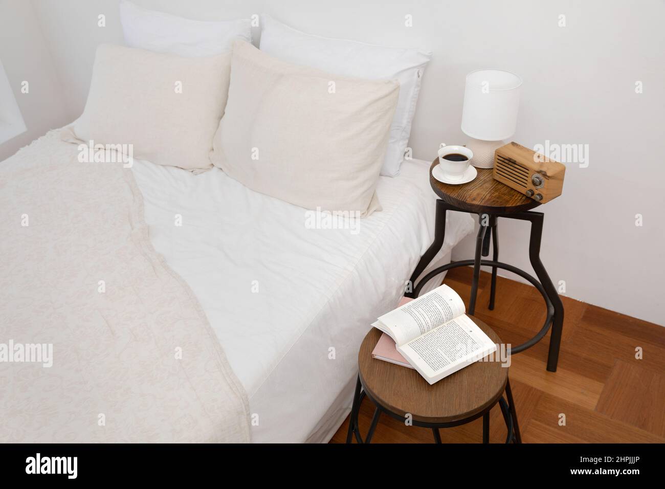 relax cozy objects and background with bedding, lights, coffee, a book ...