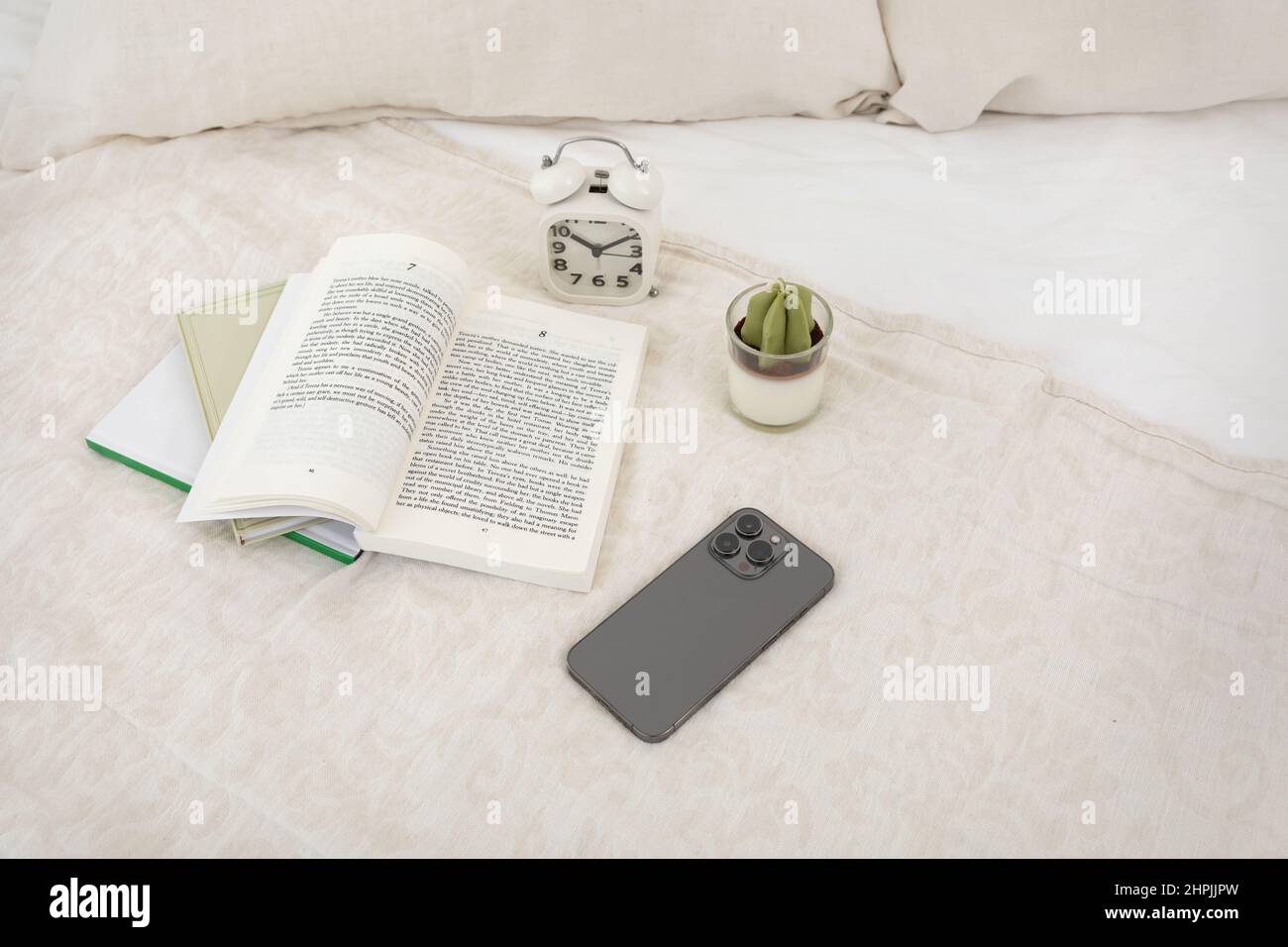 relax cozy objects and background with smart phone, a book. candle ...