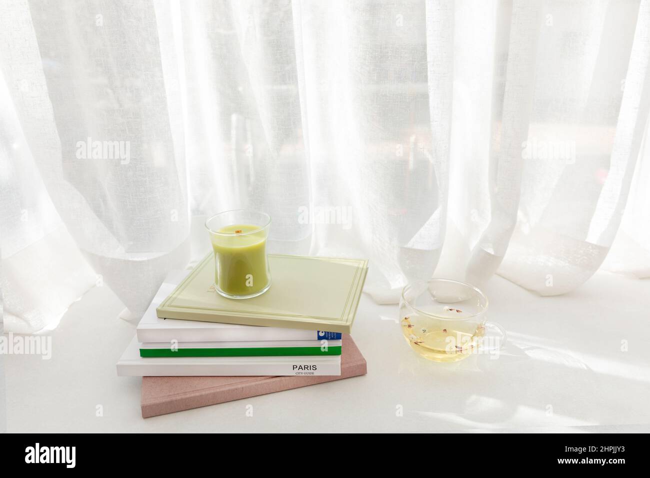 relax cozy objects and background with a book, candle, tea Stock Photo ...