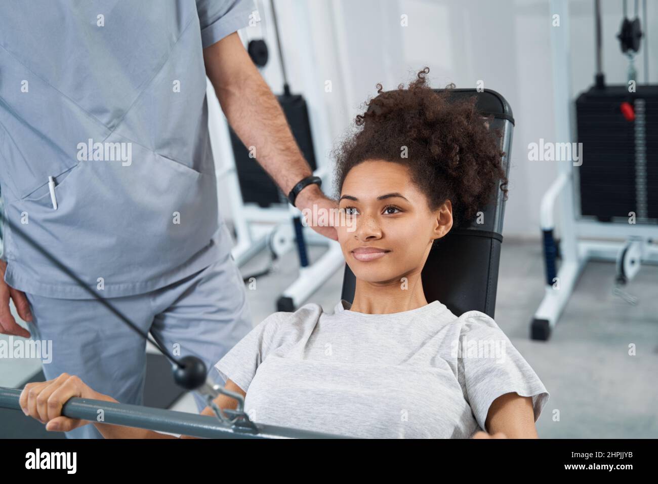 Happy lady actively training in the gym Stock Photo - Alamy