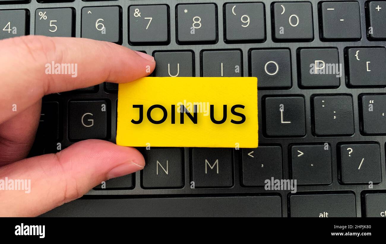 Top view of Join Us text on wooden blocks with laptop background Stock ...