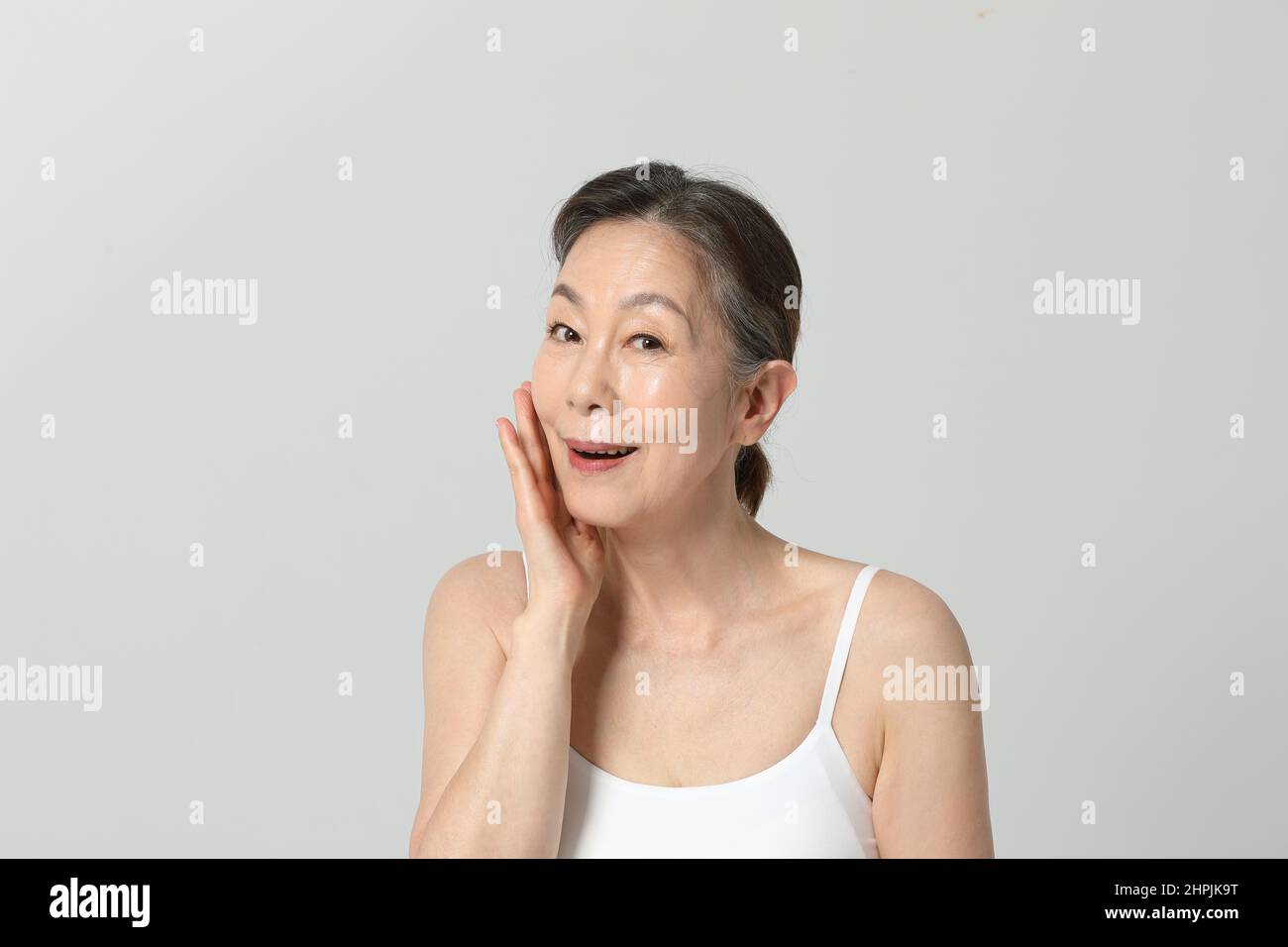 Asian Korean senior woman, basic skin care beauty concept in studio ...