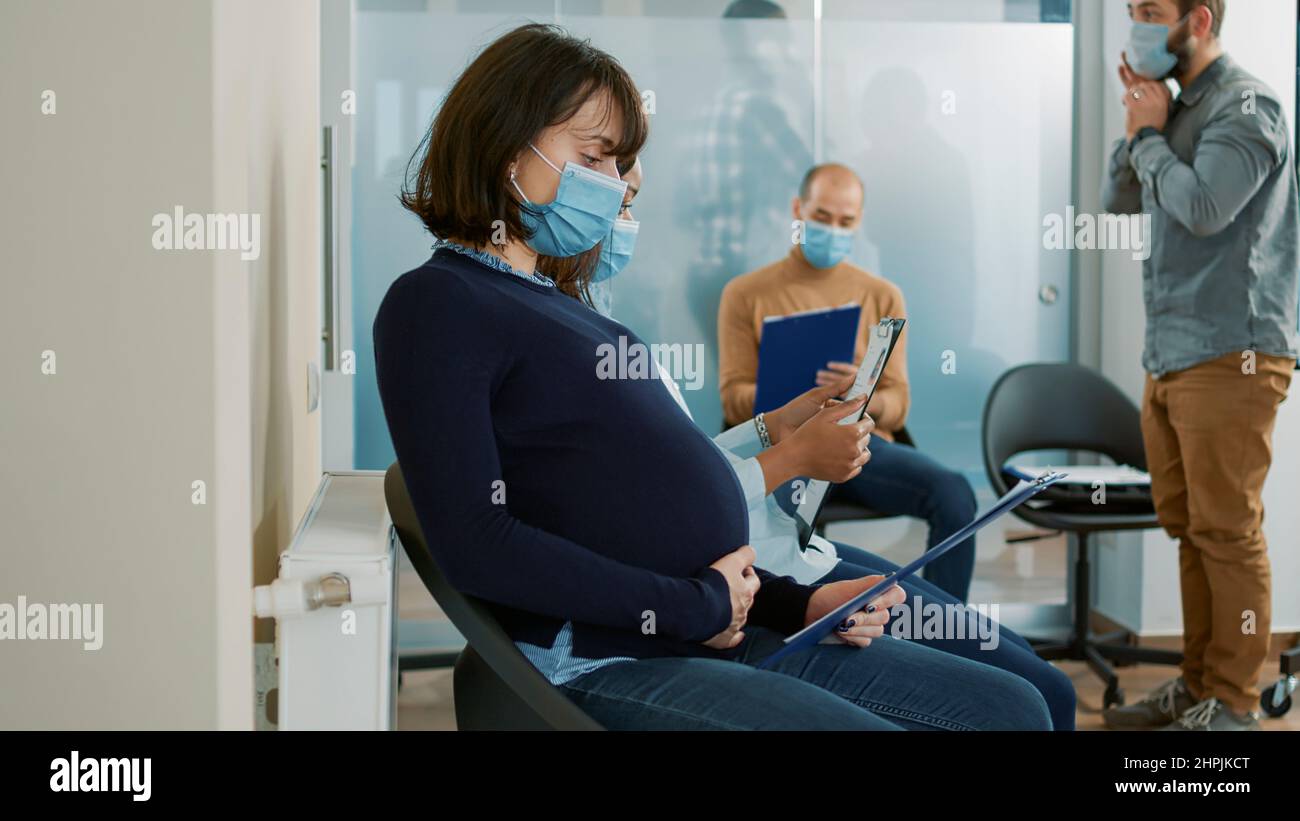 Applicant expecting child in waiting lobby at recruitment appointment ...