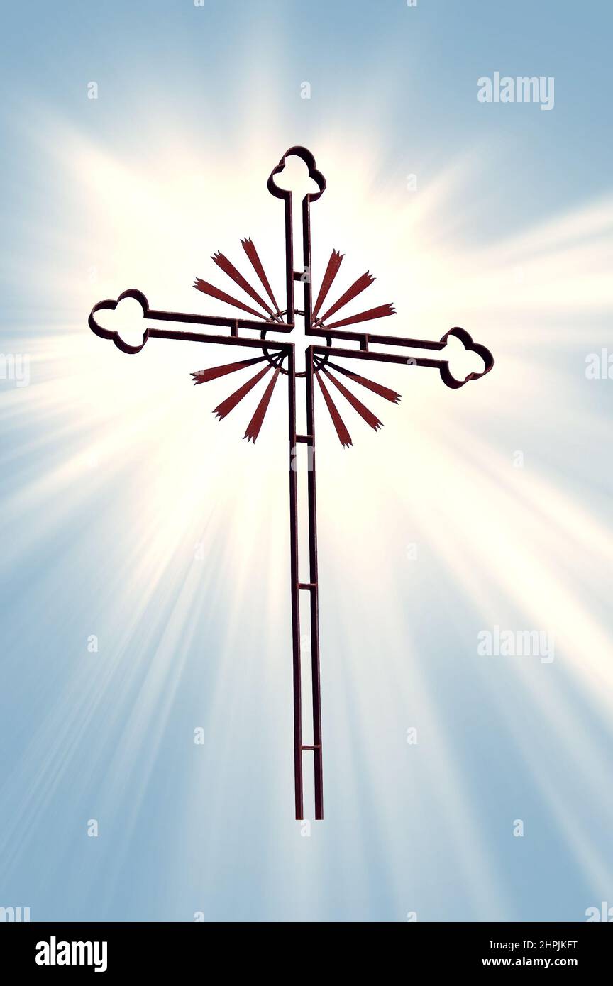 Religious cross on a vivid blue sky.Powerful cross. Cross of an ...