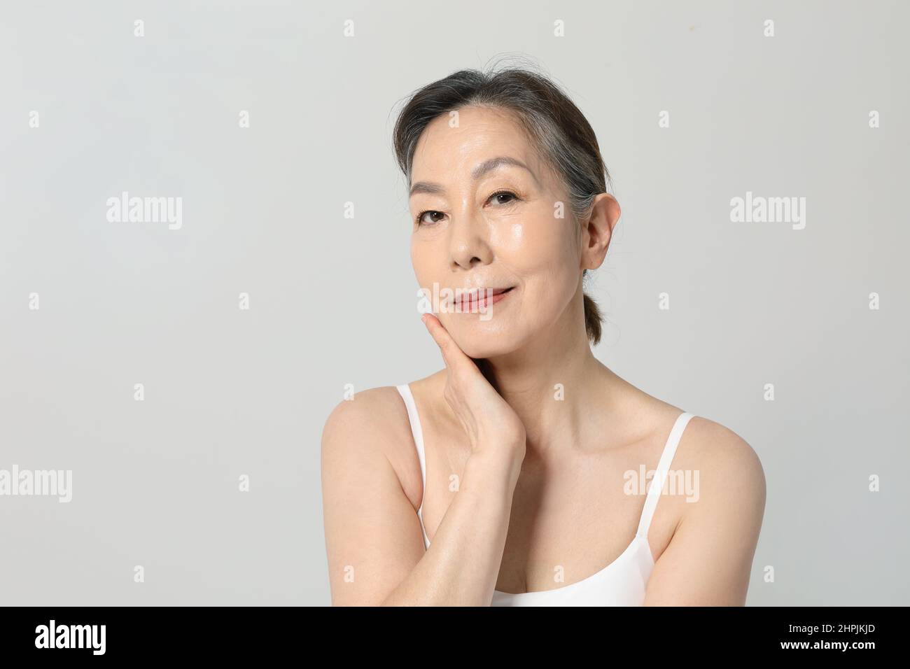 Asian Korean senior woman, basic skin care beauty concept in studio ...