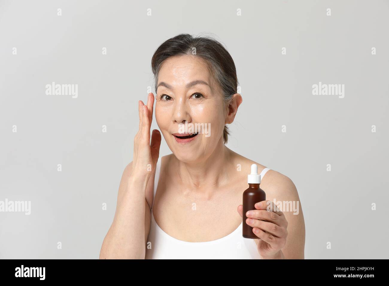 Asian Korean senior woman, basic skin care beauty concept in studio ...