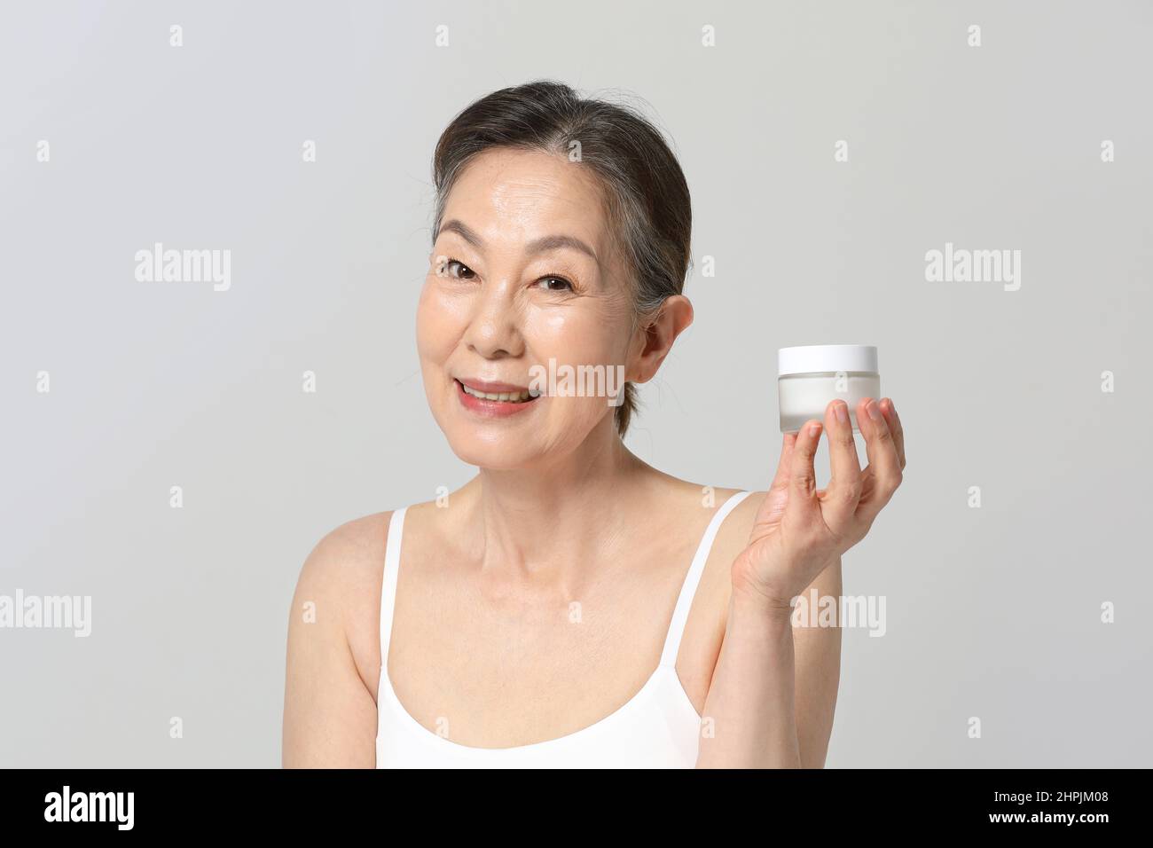Asian Korean senior woman, basic skin care beauty concept in studio ...