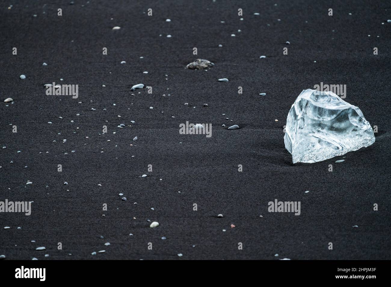 Ice diamond over diamonds beach in Jokulsarlon Stock Photo - Alamy