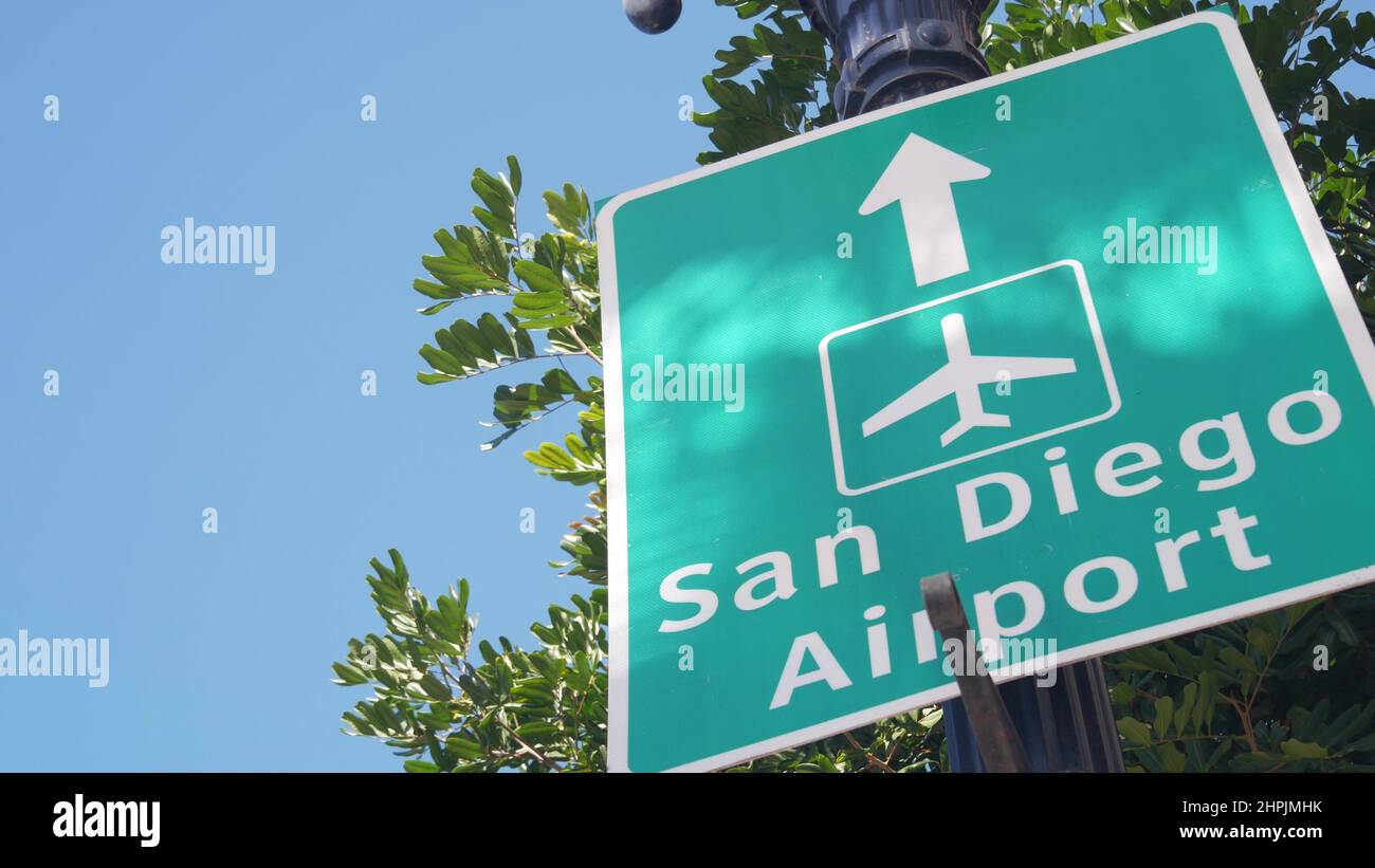 Airport green road sign with direction arrow and plane icon, San Diego ...