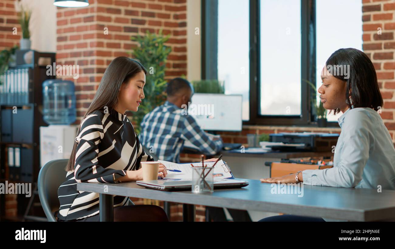 Female candidate greeting HR recruiter at job interview in company ...